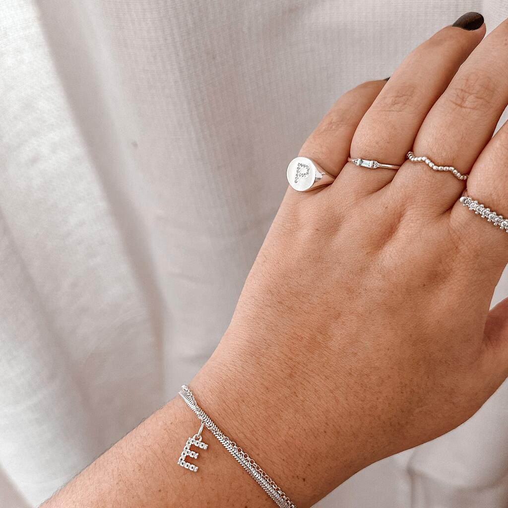 Comprar ANEL LETRA CRAVEJADA REGULÁVEL NO190 - Purpose Pratas